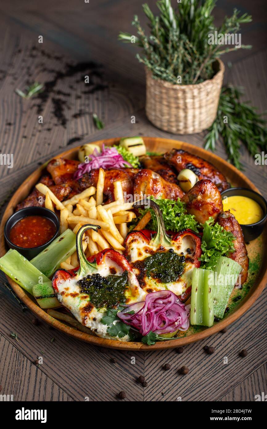 Fried chicken wings and French fries. Menu Stock Photo - Alamy