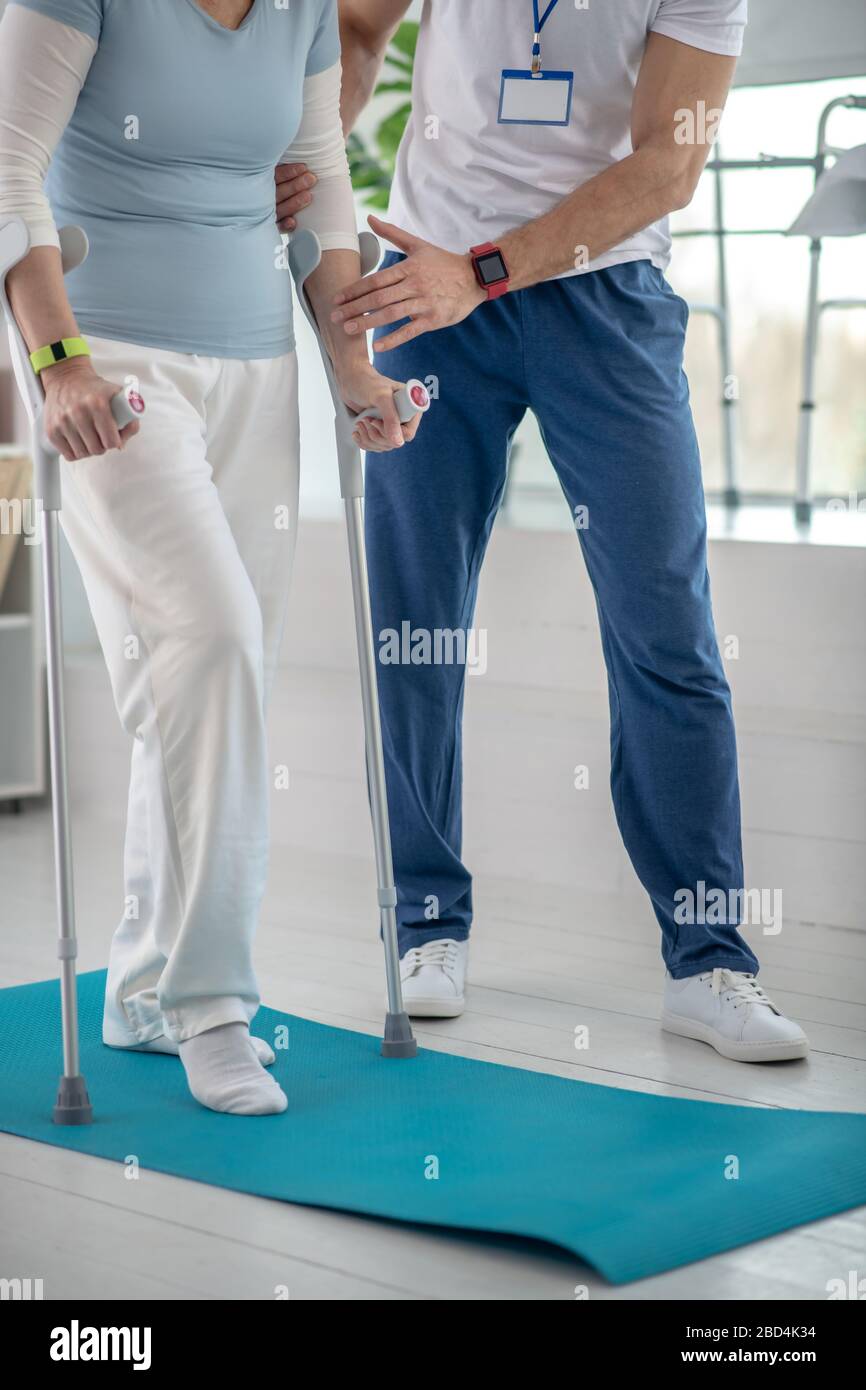 Close up of crutches being in use Stock Photo - Alamy