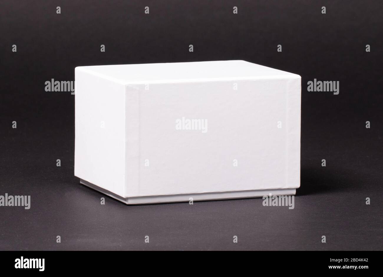 Blank White box isolated on a black background Stock Photo - Alamy