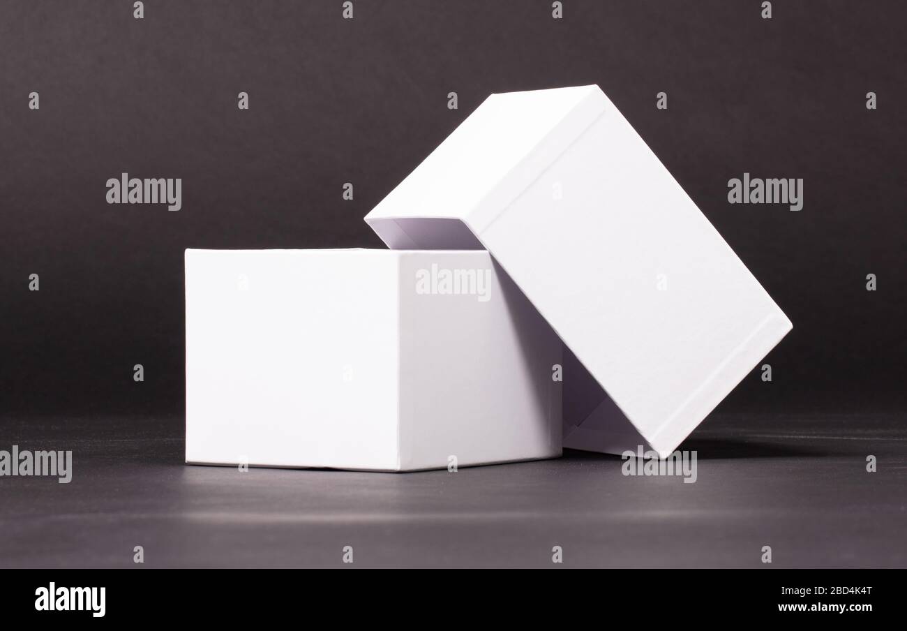 Opened blank White box isolated on a black background Stock Photo - Alamy