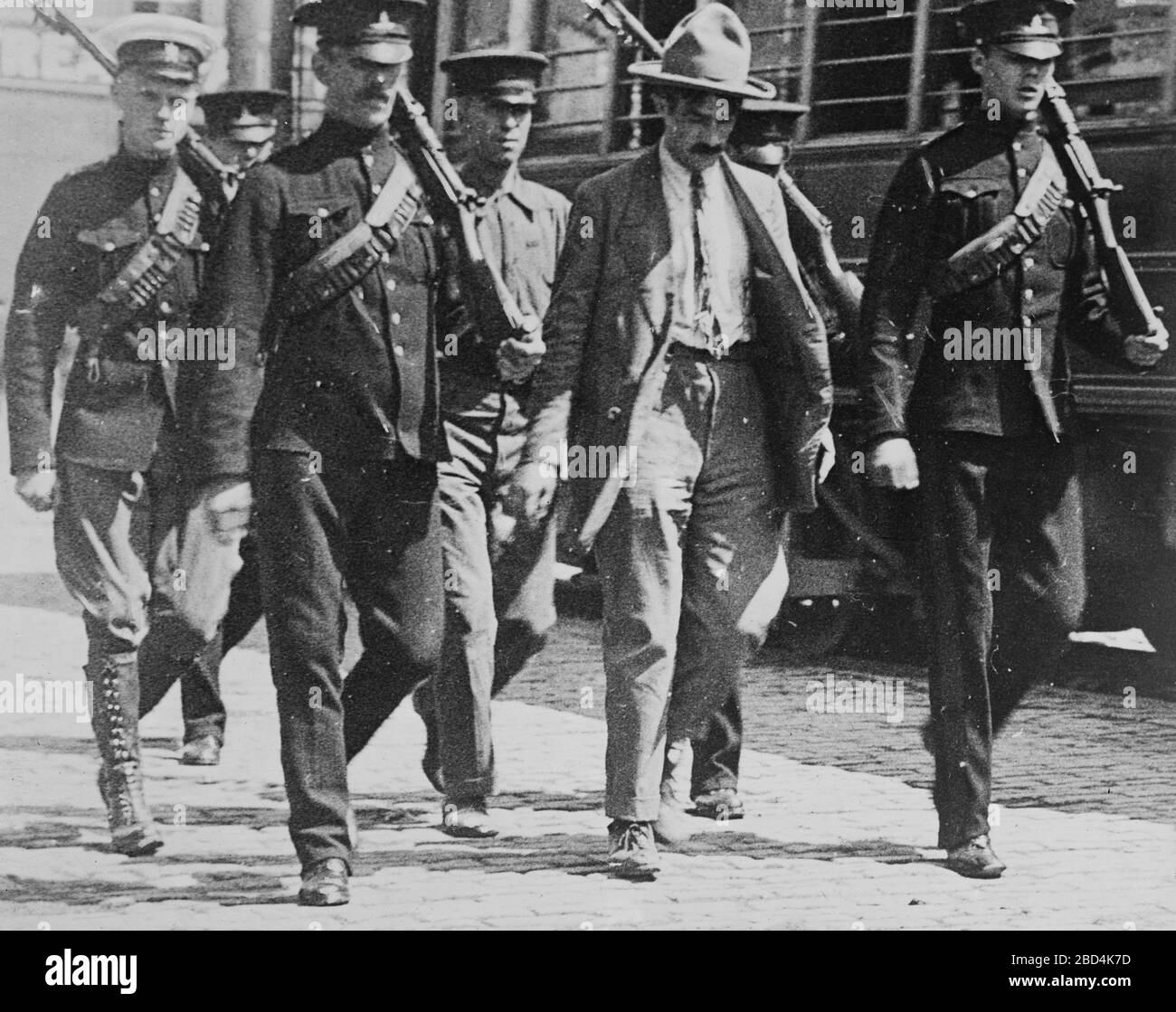 Canadian soldiers with a German man who is being arrested in Montreal ...