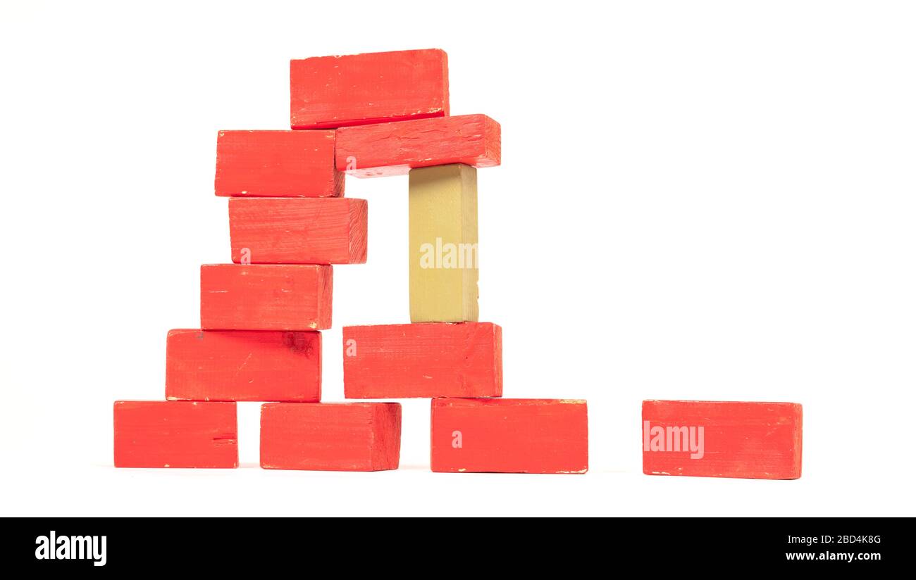 Vintage red building blocks isolated on white background, one standing ...