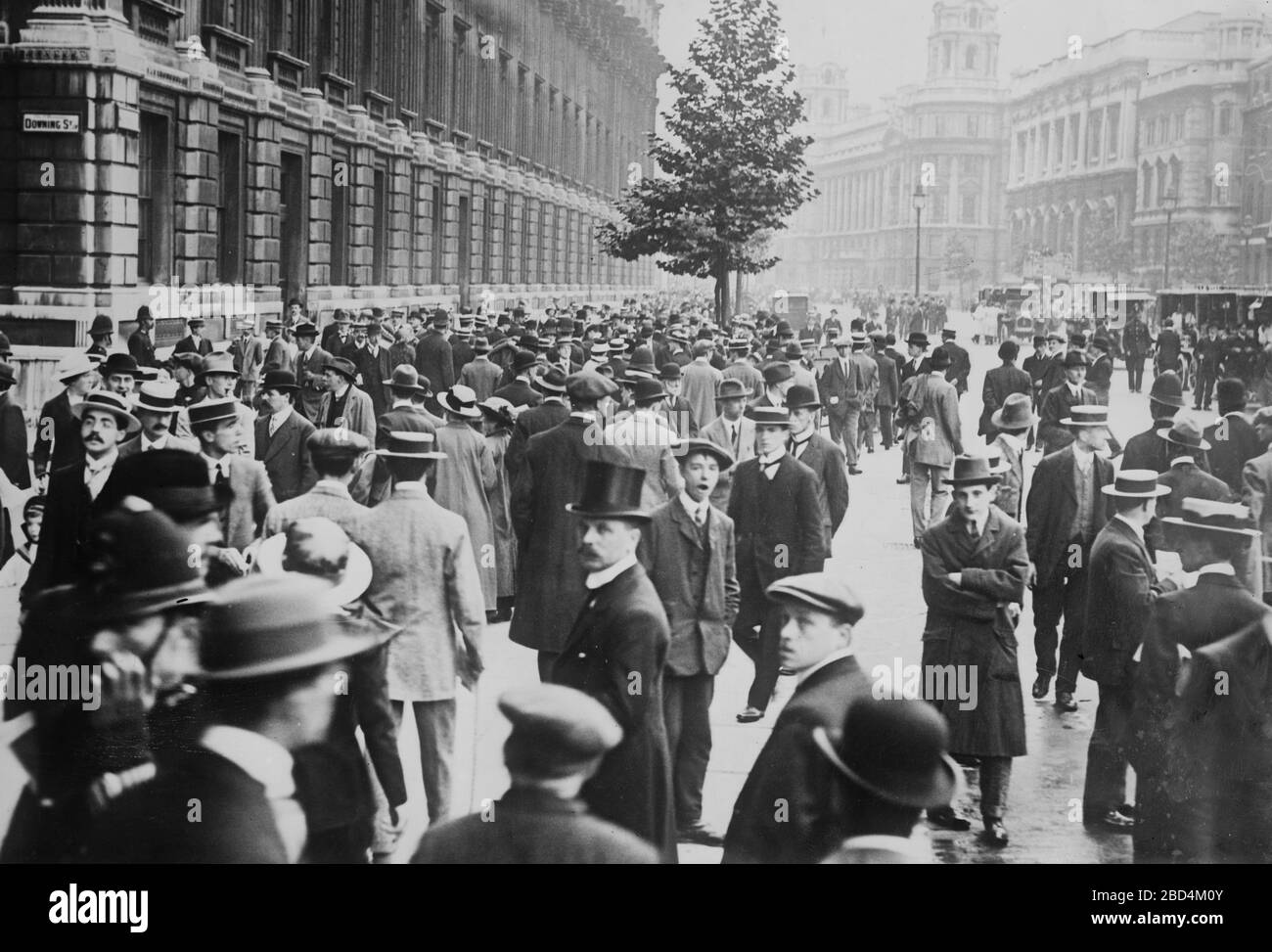 Crowd of people in Whitehall Street, near the corner Downing Street ...