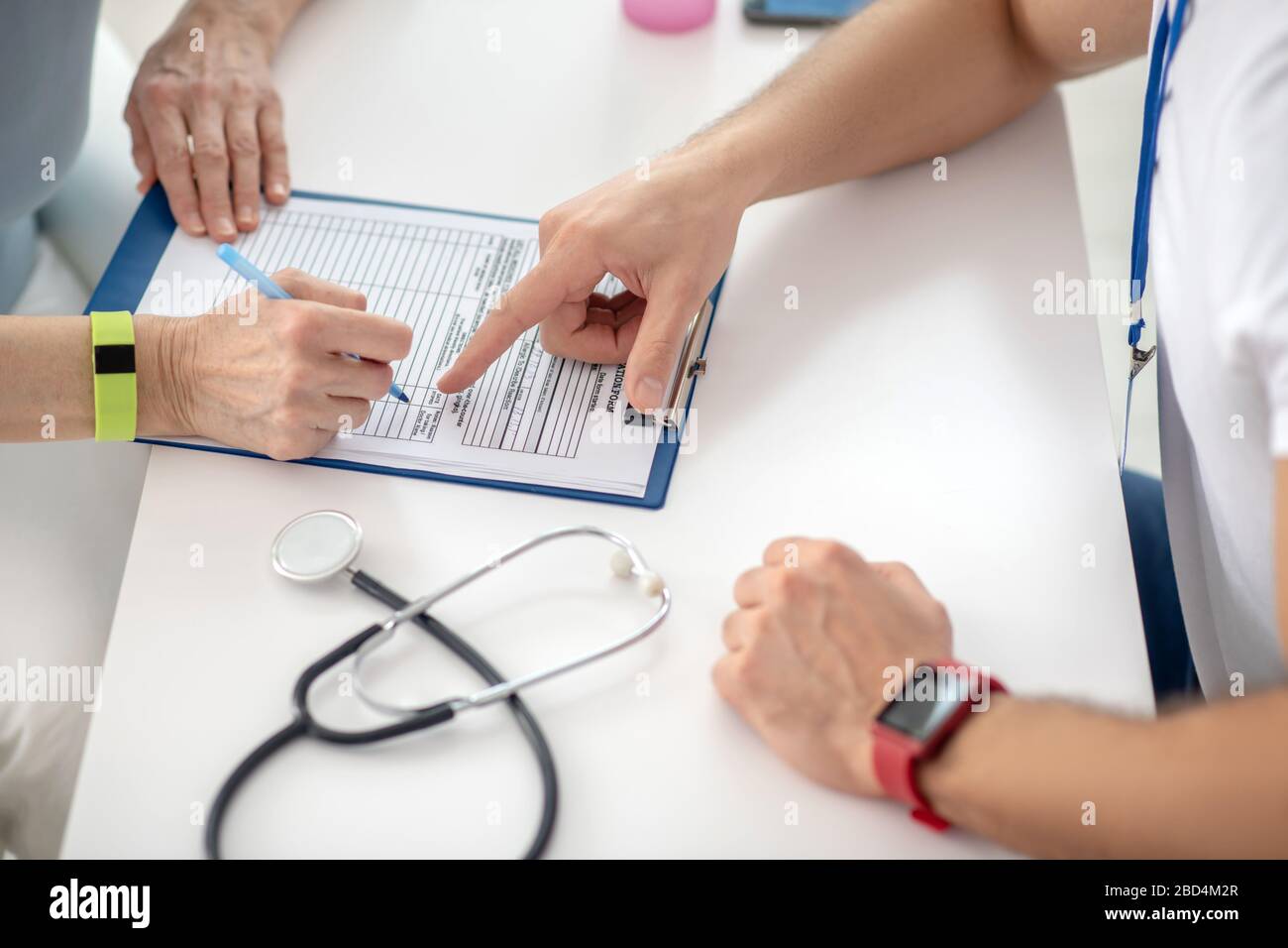 Nice professional doctor pointing hi-res stock photography and images ...