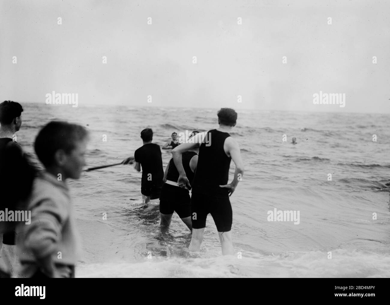 Men playing water baseball ca. 1914 Stock Photo - Alamy