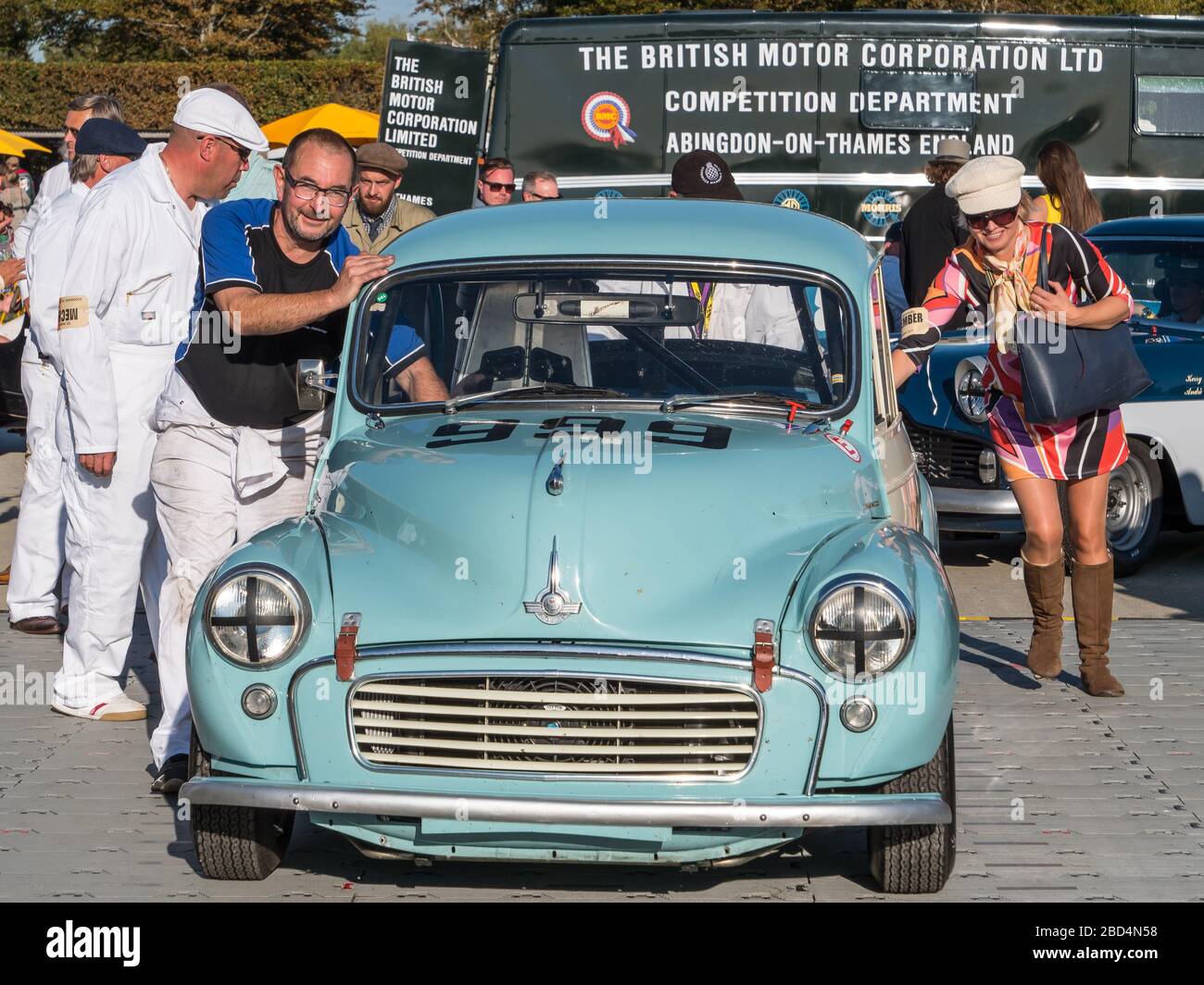 1959 Morris Minor race car being pushed in the paddock area, Goodwood ...