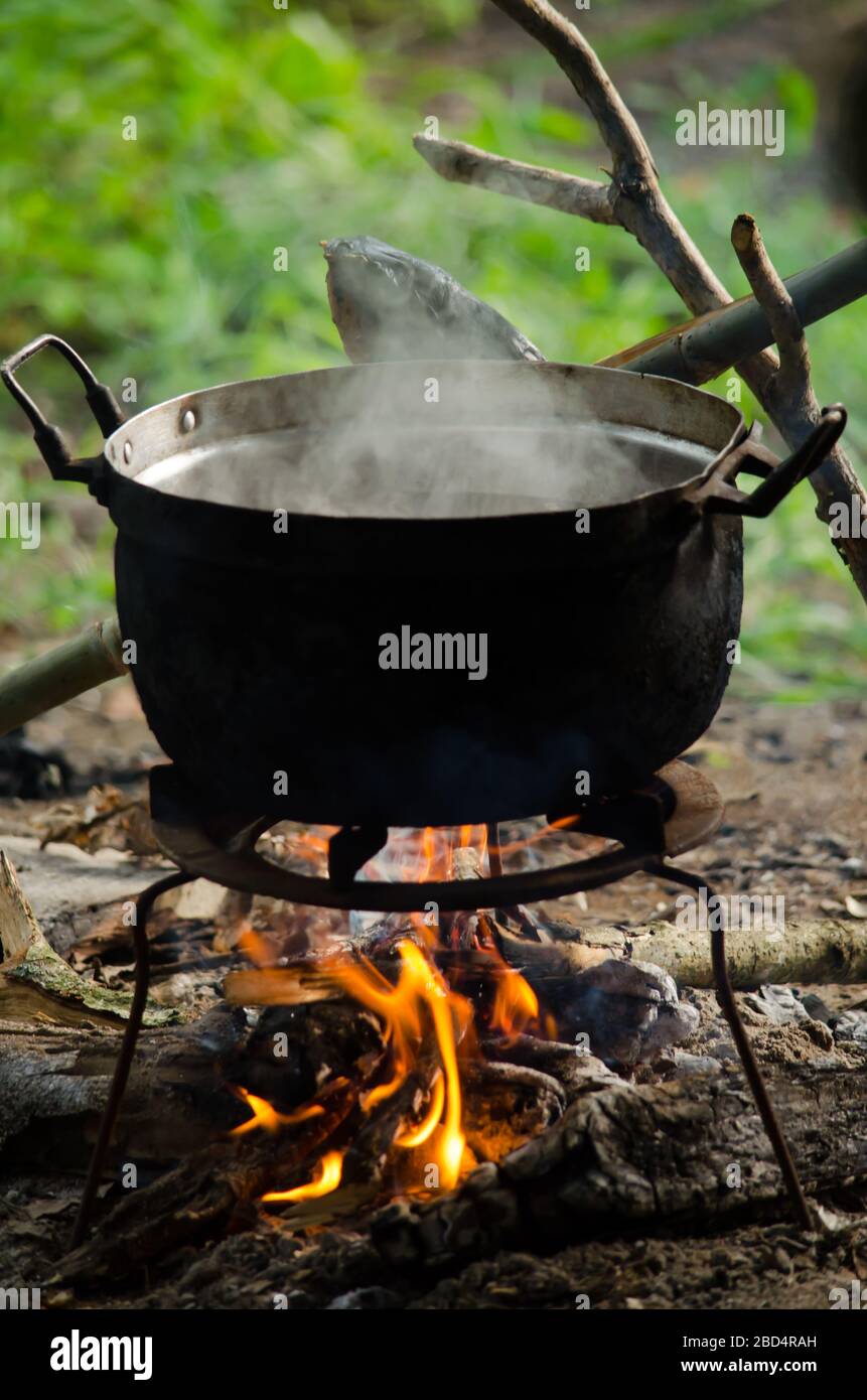 Fire burning under pot hi-res stock photography and images - Alamy