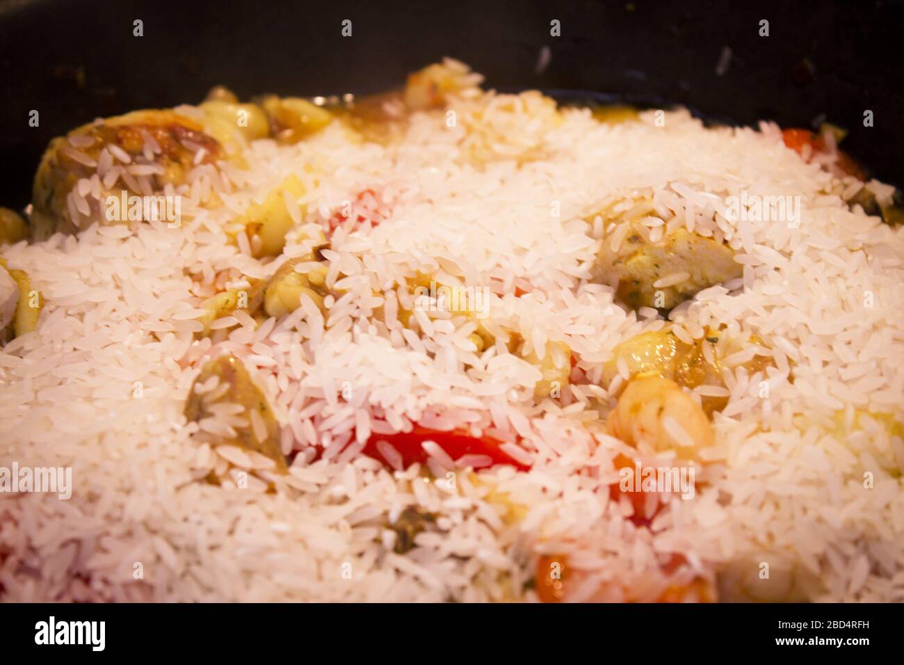 Half cooked rice for paella. No people Stock Photo - Alamy