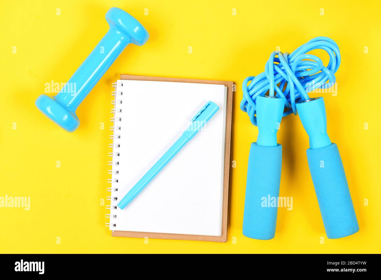 Notepad and fitness tools. Weight loss and active lifestyle concept ...