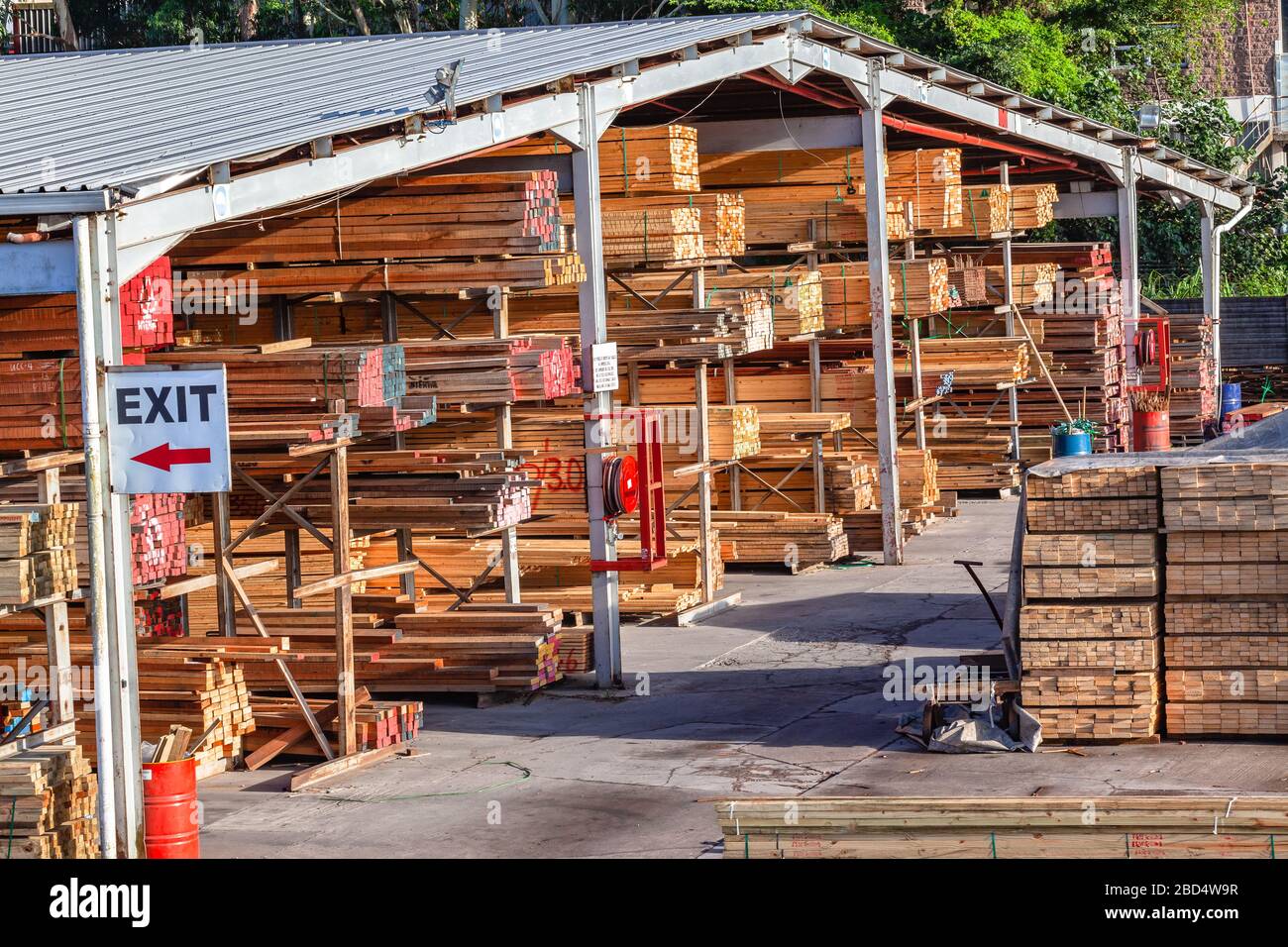 Wood timber yard warehouse open plan outdoor with racks of cut product ...