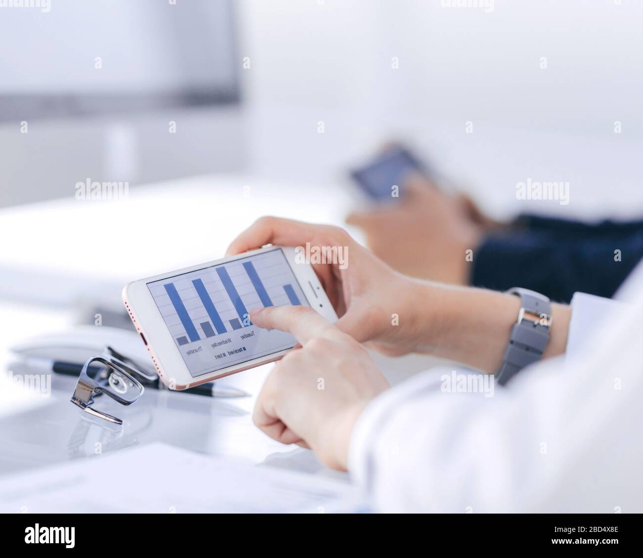 close up.employees use their gadgets sitting at the Desk.people and ...