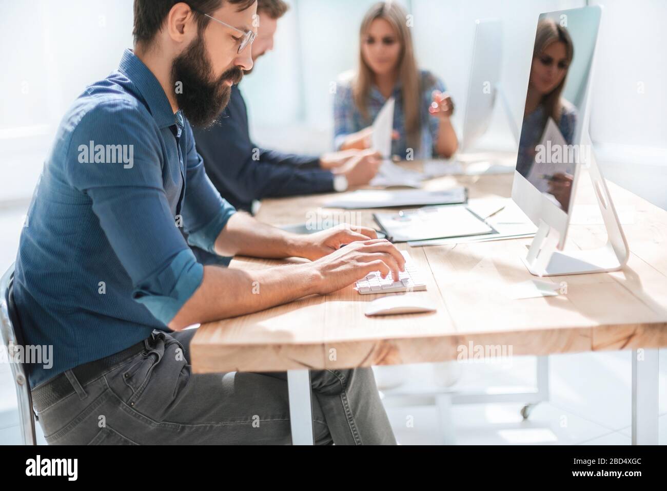 businessman uses a computer in the workplace in the office Stock Photo ...