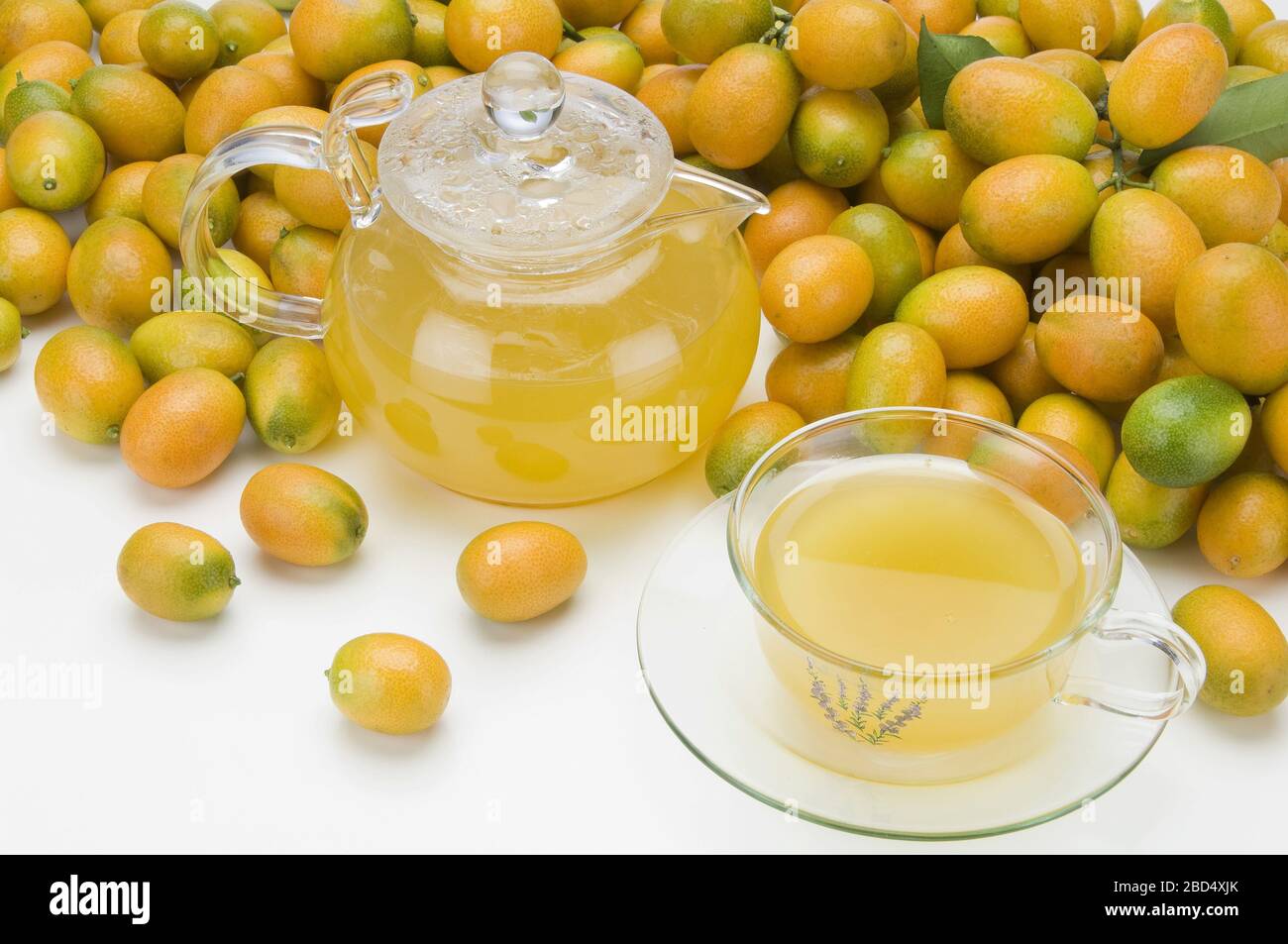 kumquat and tea set on the white background Stock Photo - Alamy