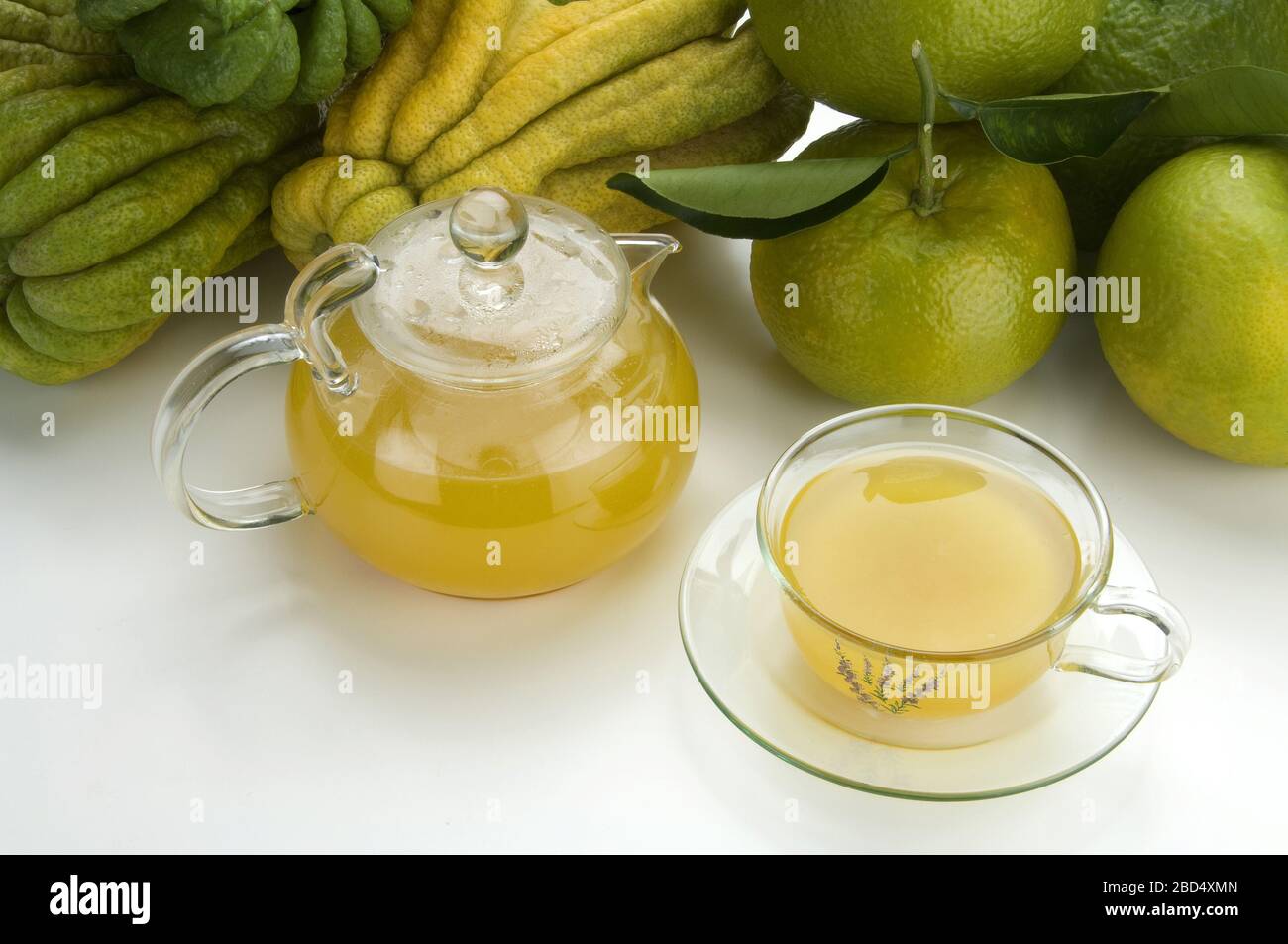 Bergamot and tea set on the white background Stock Photo - Alamy