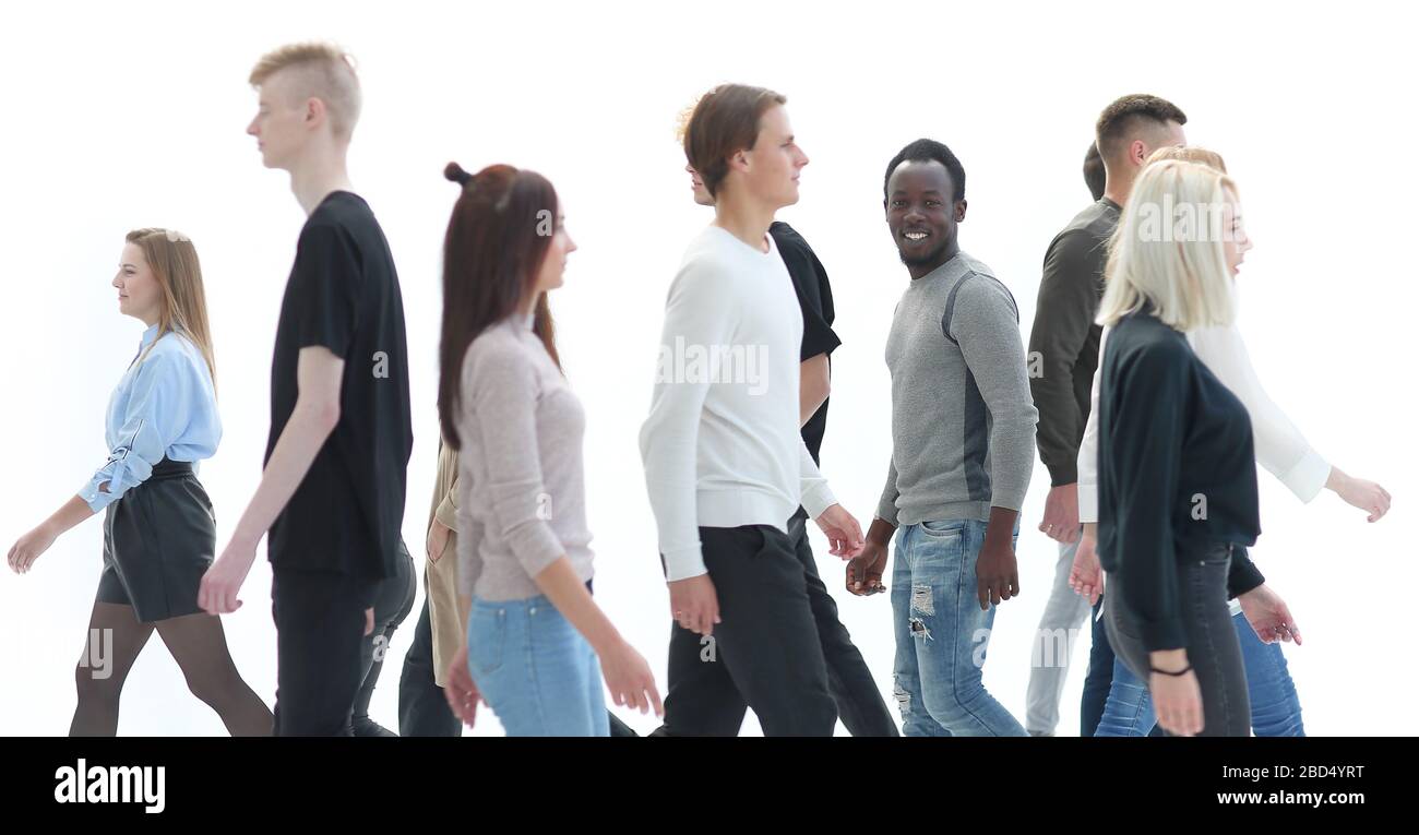 in full growth. diverse young people walking in different directions ...