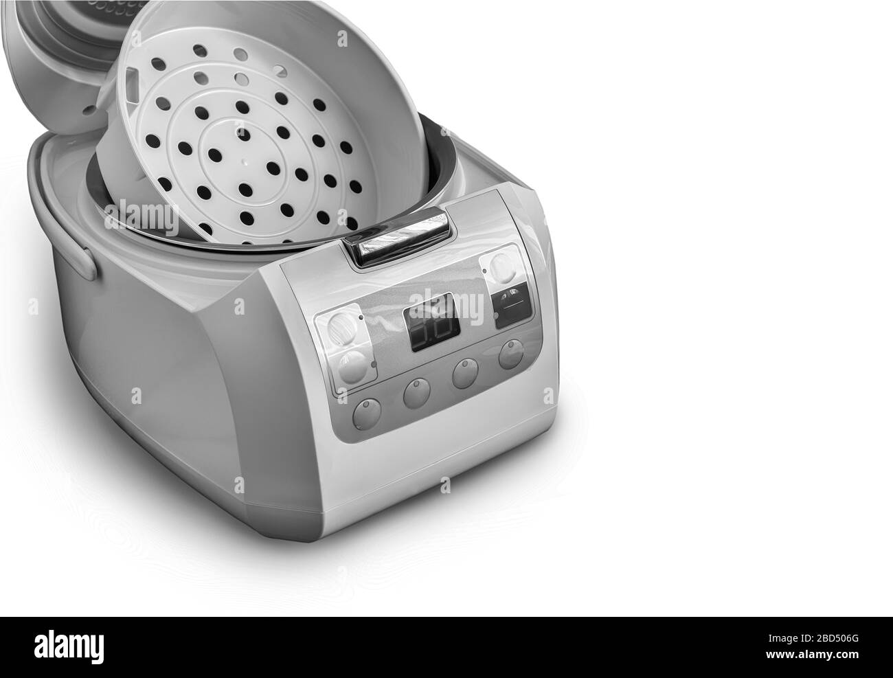 Modern electric slow cooker on a light background Stock Photo - Alamy