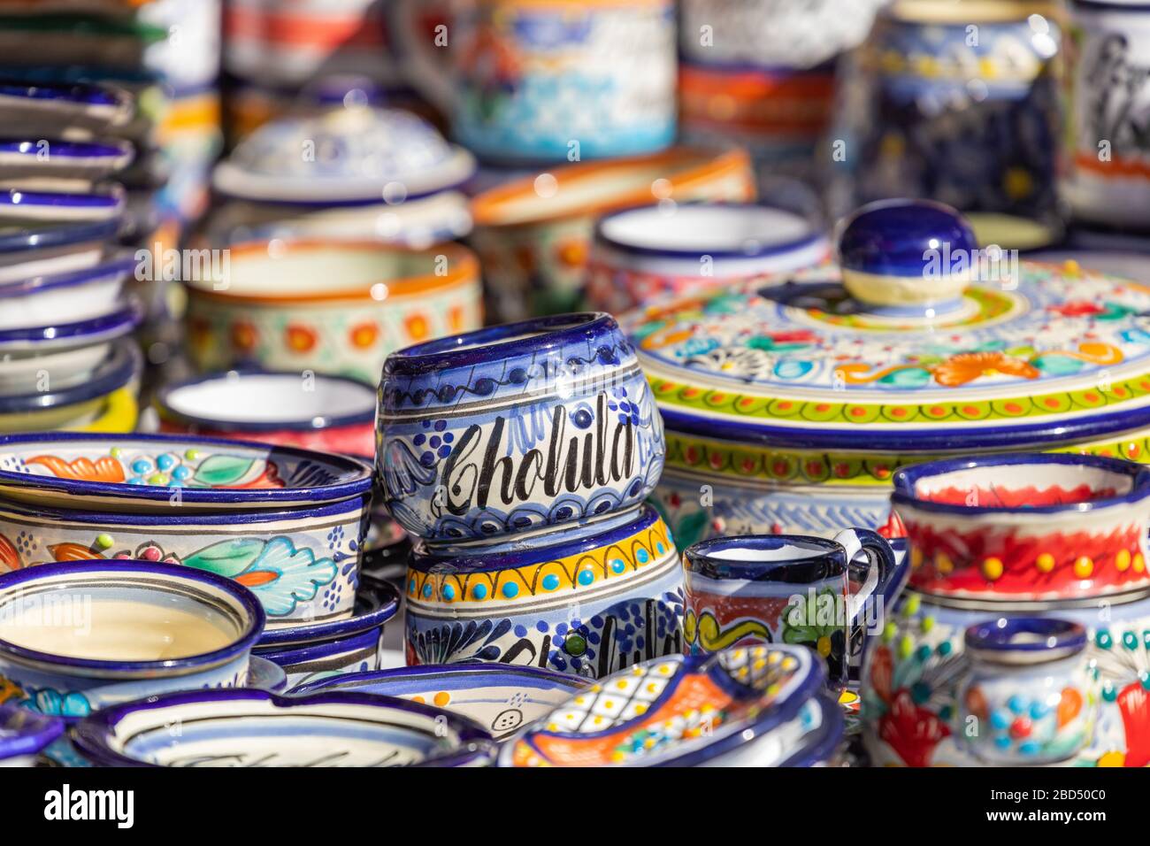 Colorful traditional Mexican pottery. Talavera style. Souvenirs on sale ...