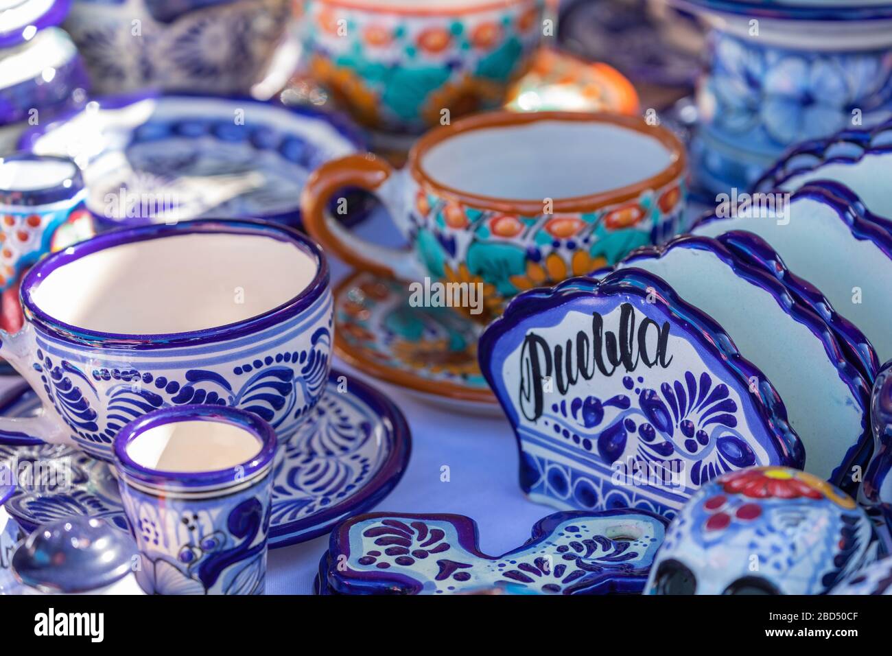 Colorful traditional Mexican pottery. Talavera style. Souvenirs on sale ...