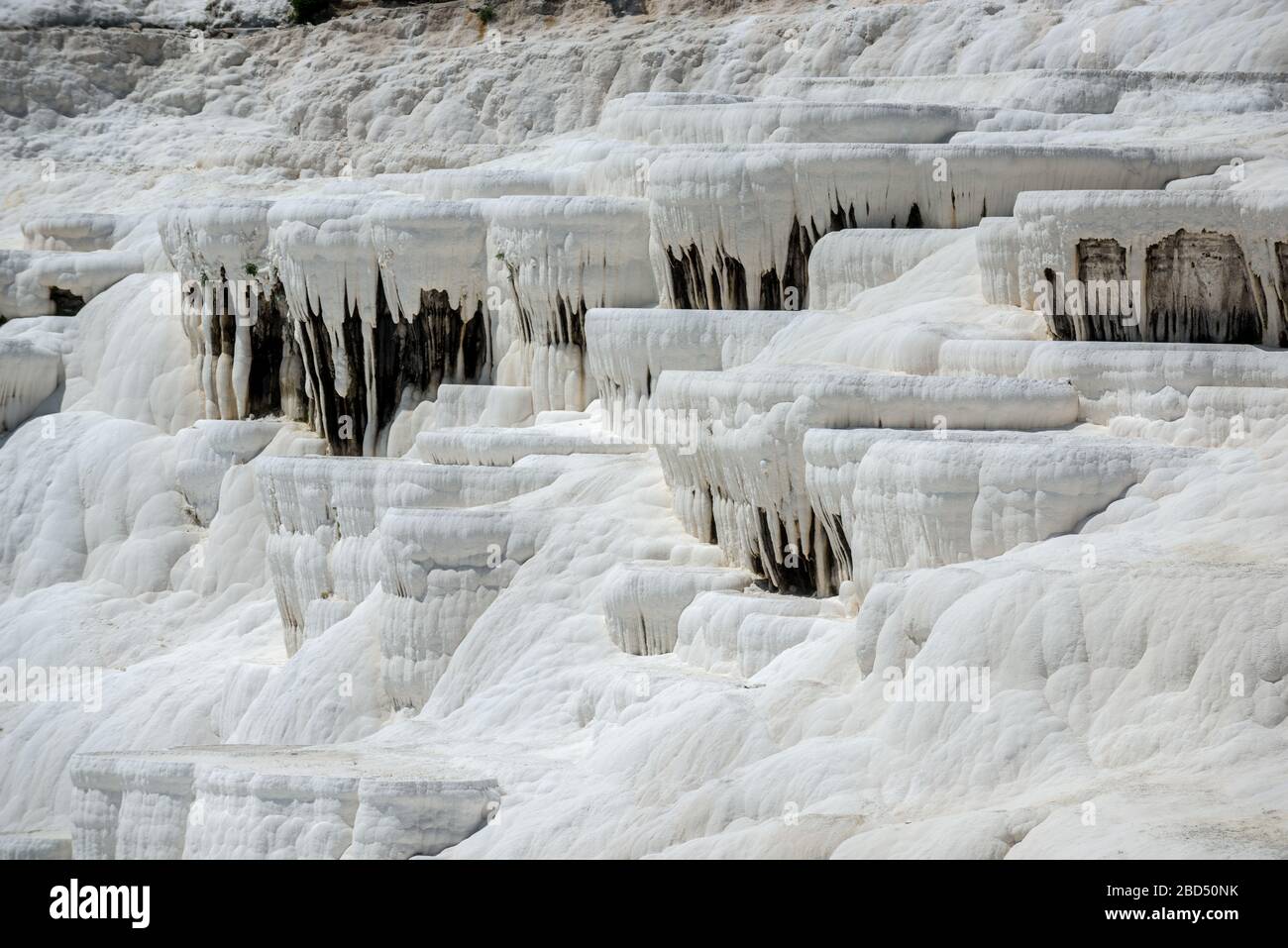 Travertine terrace formations at Pamukkale, Turkey. Travertine - a ...