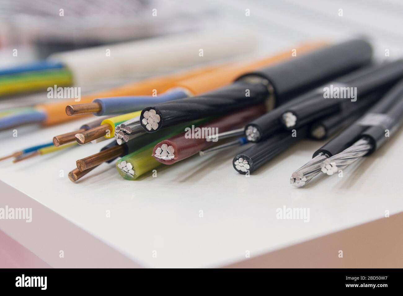 Samples of power electrical cables in the showroom. Industry Stock ...