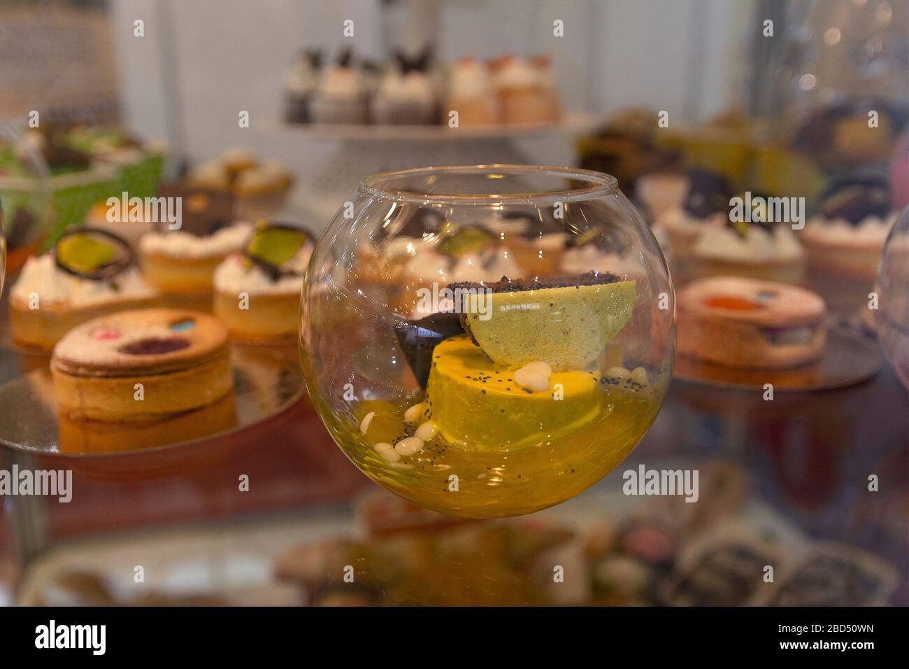 Delicious cakes with different fillings on the window. Dessert Stock ...