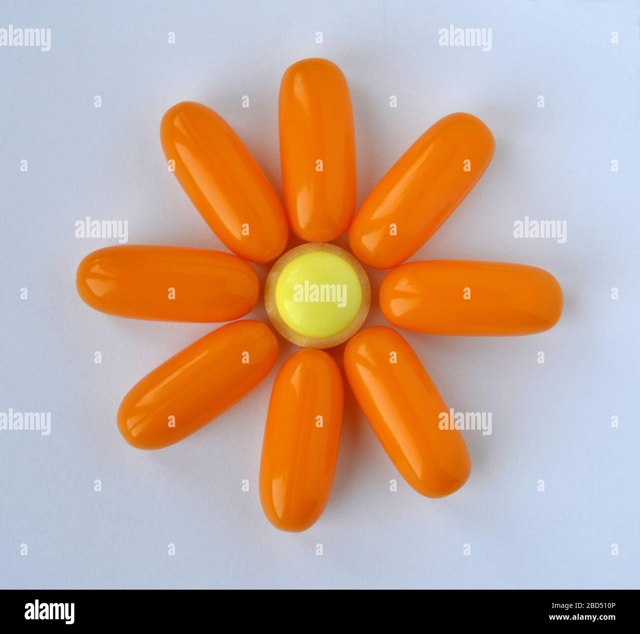 Bright pills create composition "Flower" on the white background Stock ...