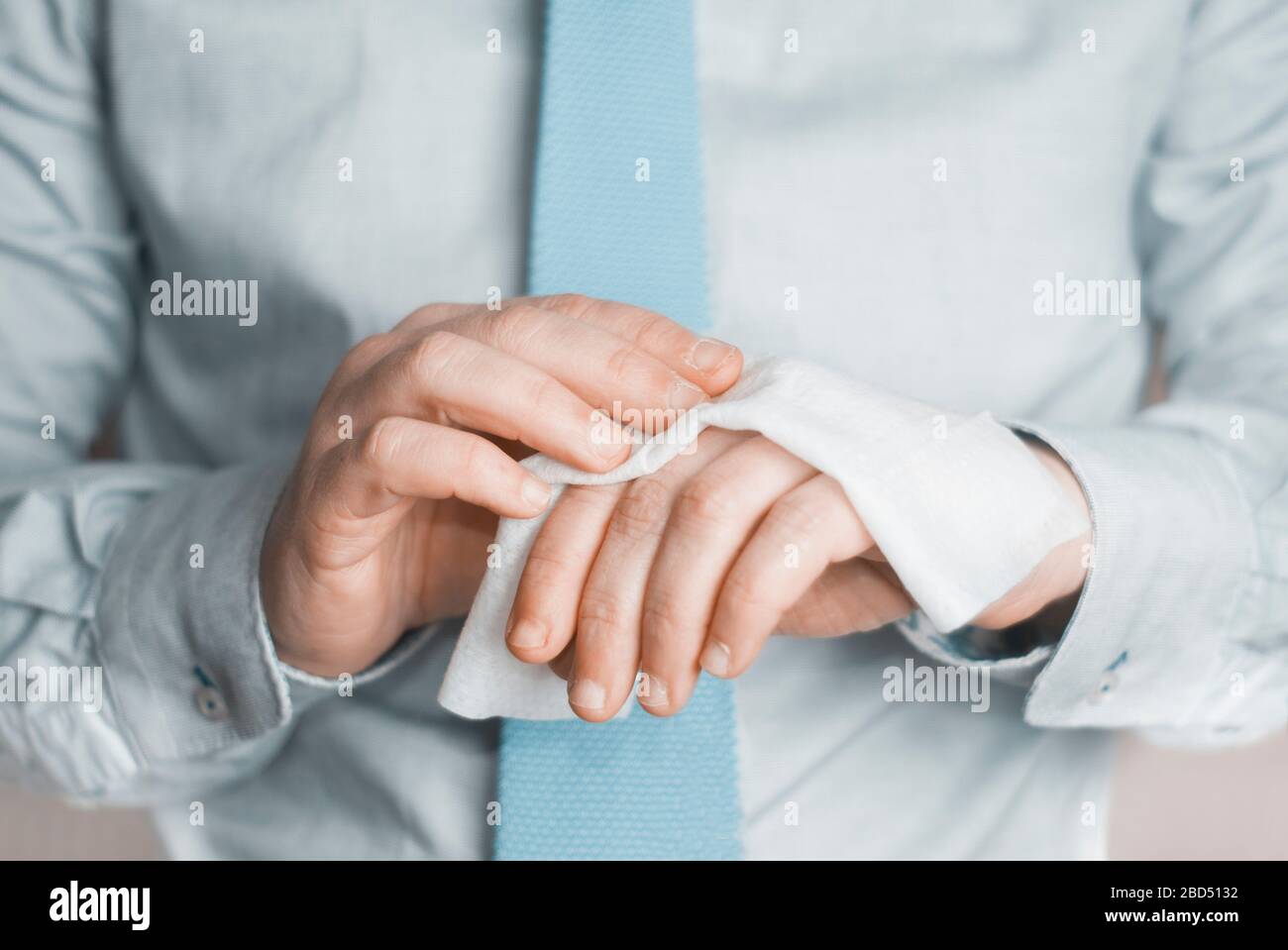 Hand washing concept: businessman washes and disinfects his hands using ...