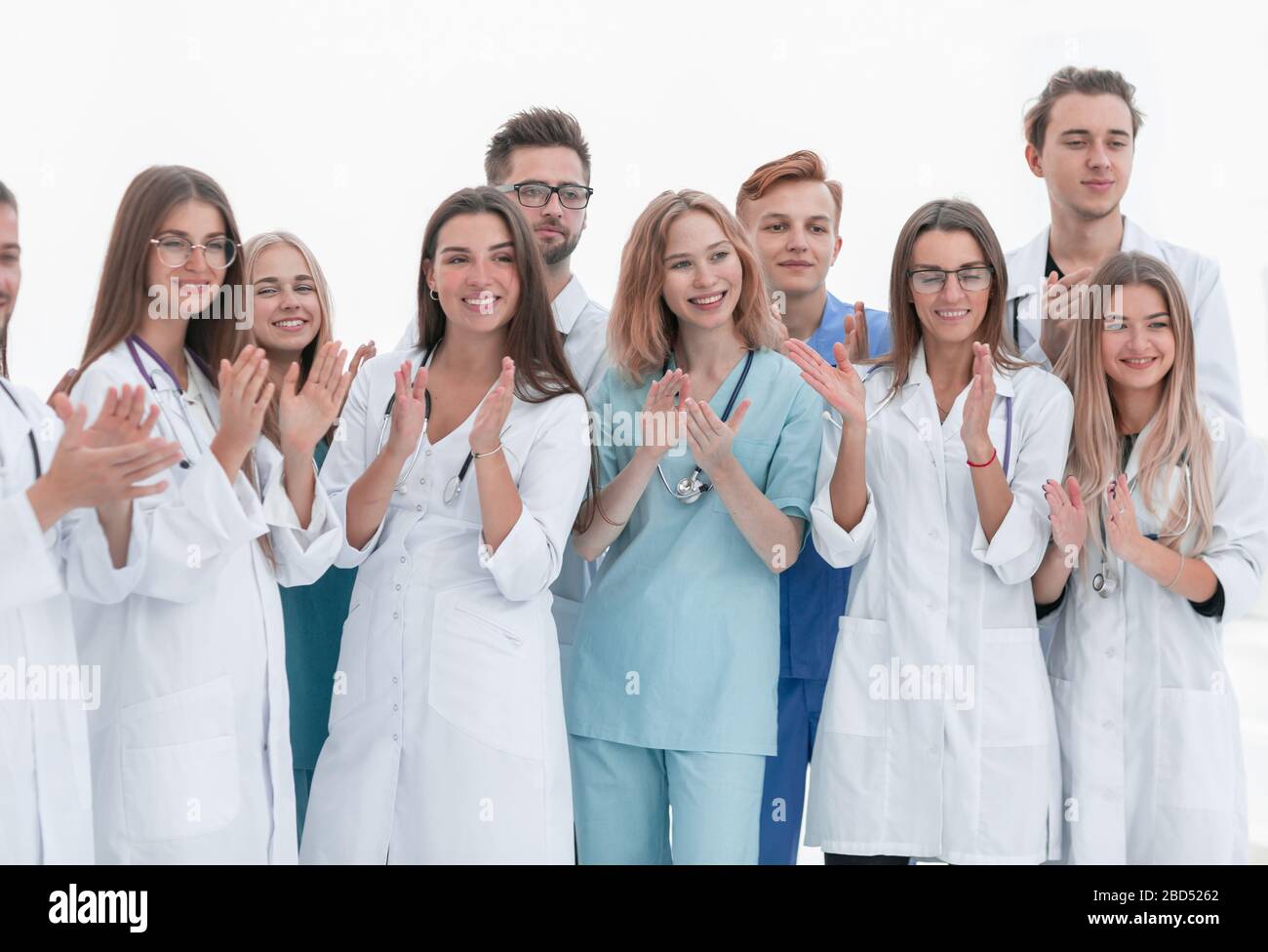 close up. a group of different doctors applauds together Stock Photo ...