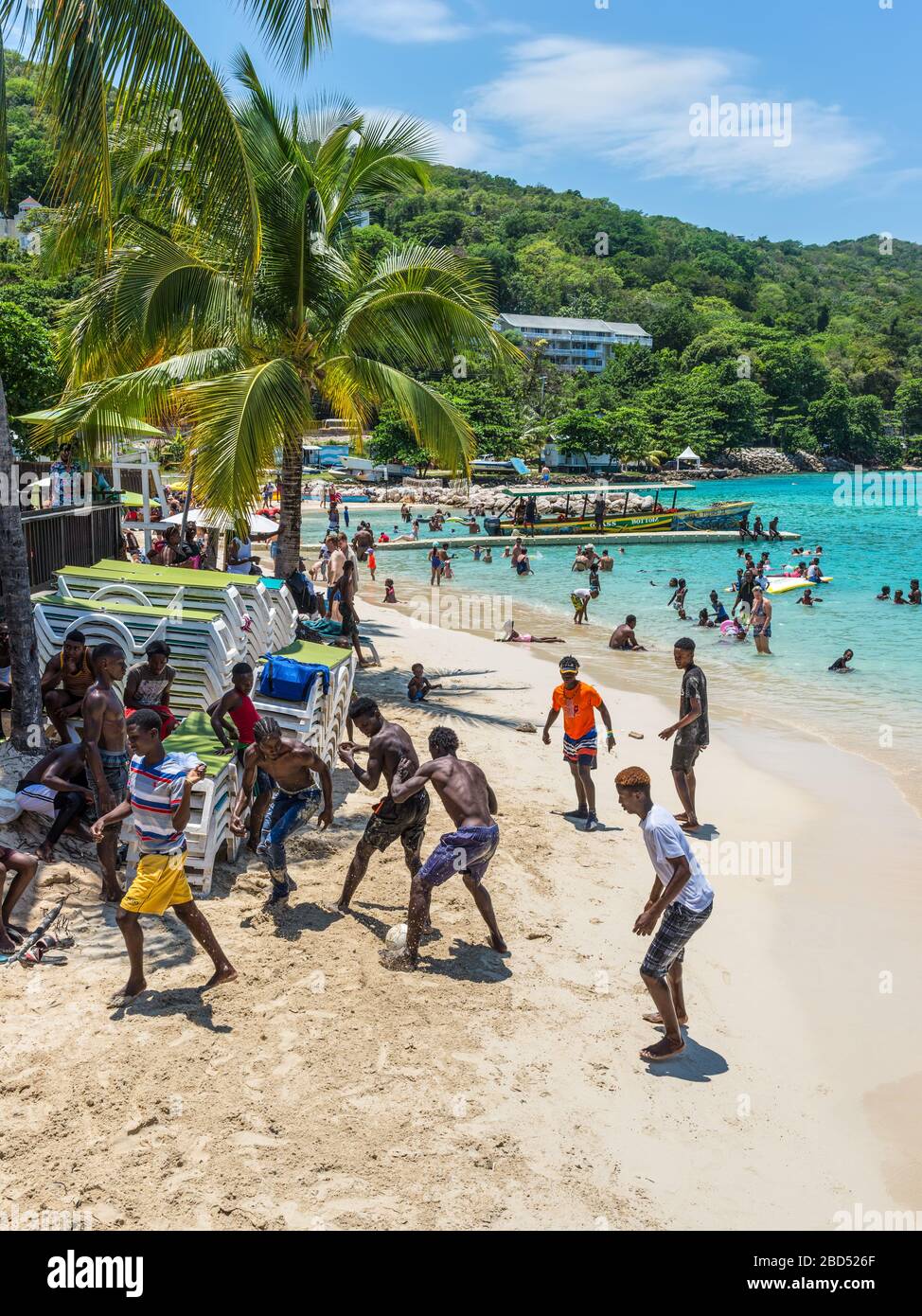 Ocho Rios, Jamaica - April 22, 2019: Group of friends playing soccer on ...