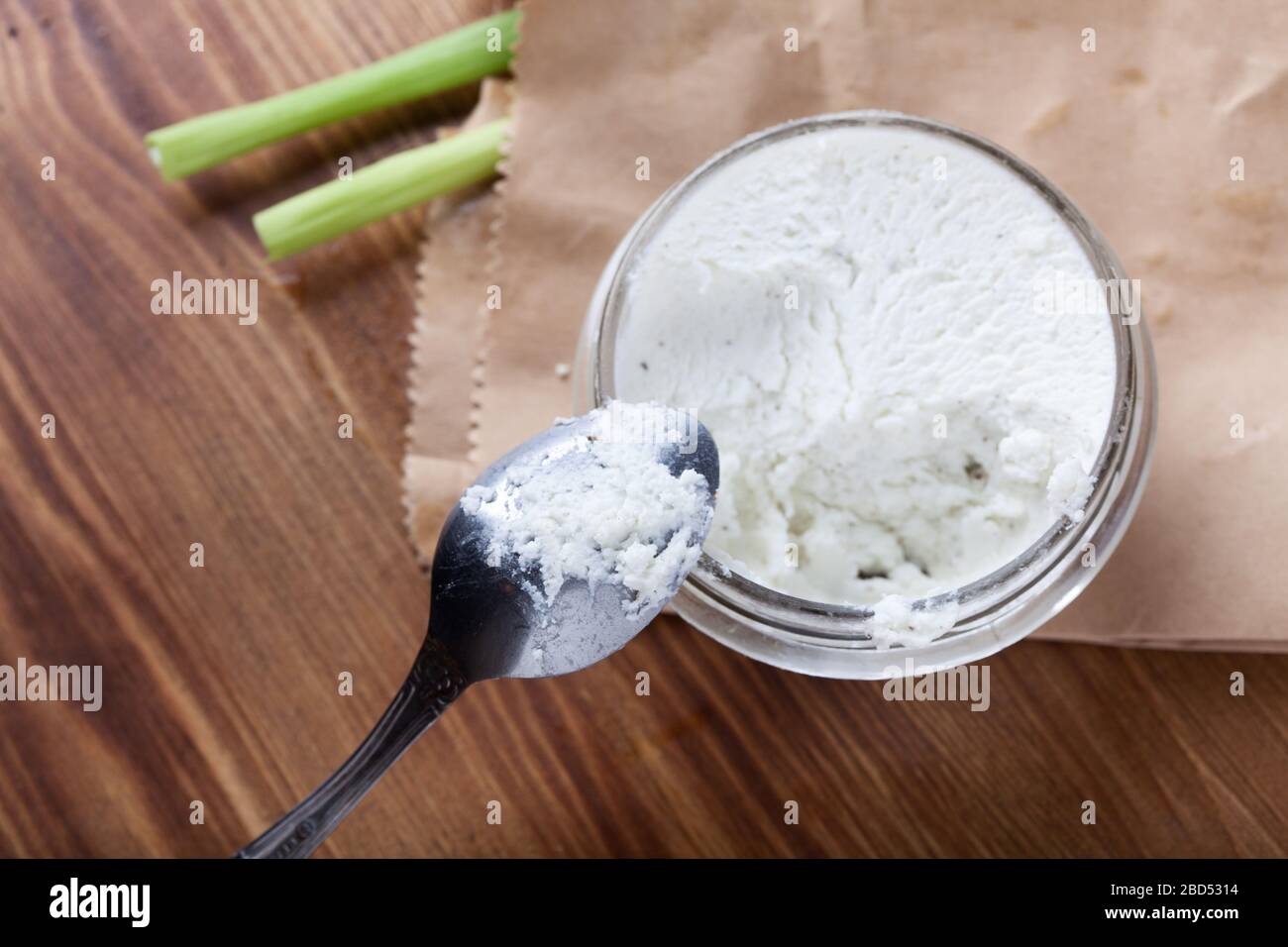 goat cheese in an open glass jar Stock Photo - Alamy