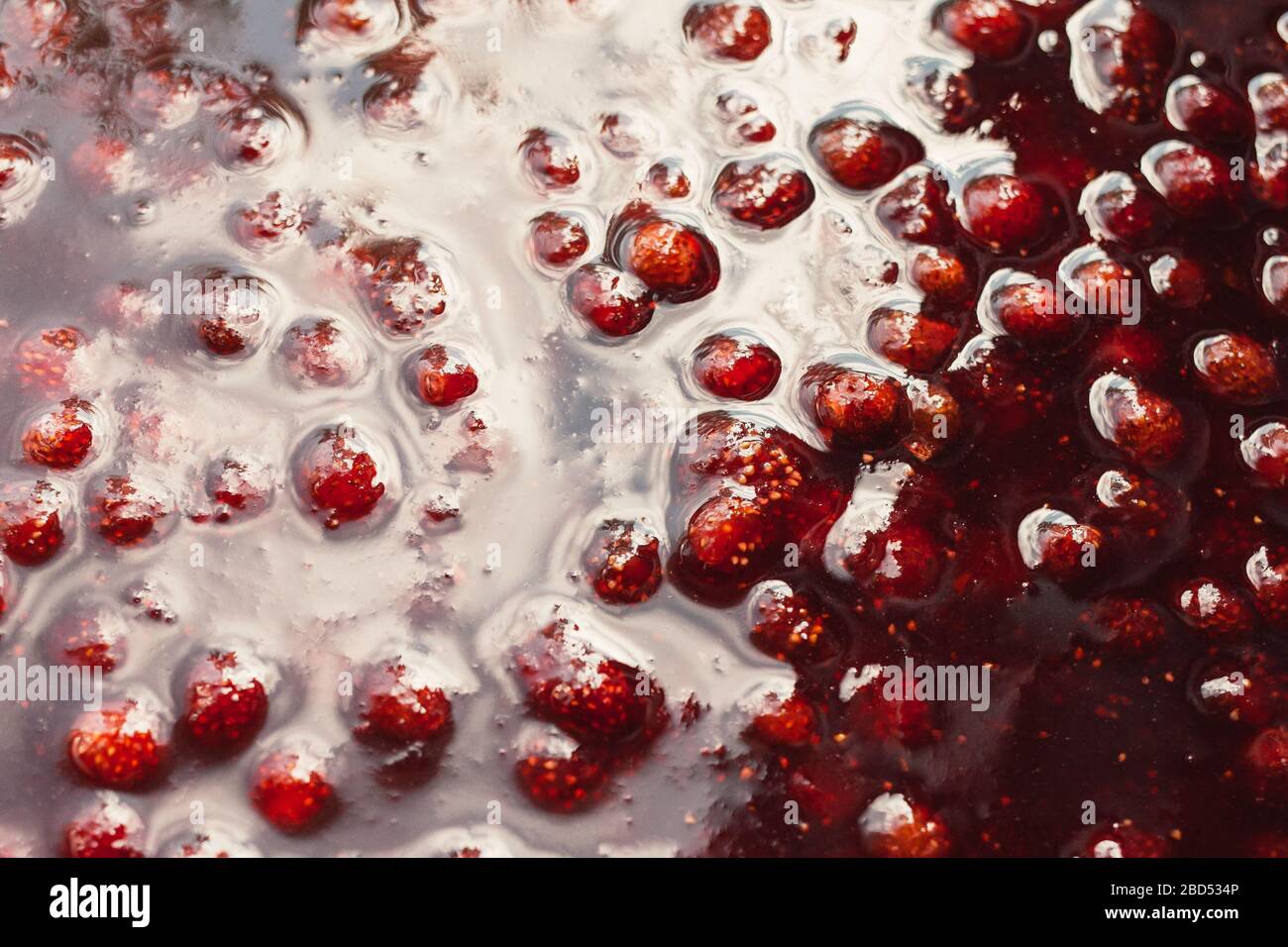 beautiful glare texture of strawberry jam closeup, food background ...
