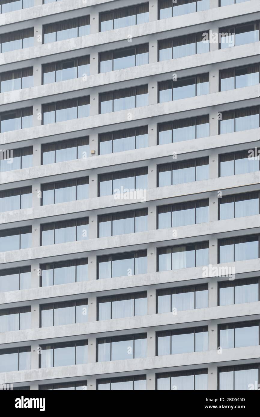 Perspective view of modern grey building facade background of living ...