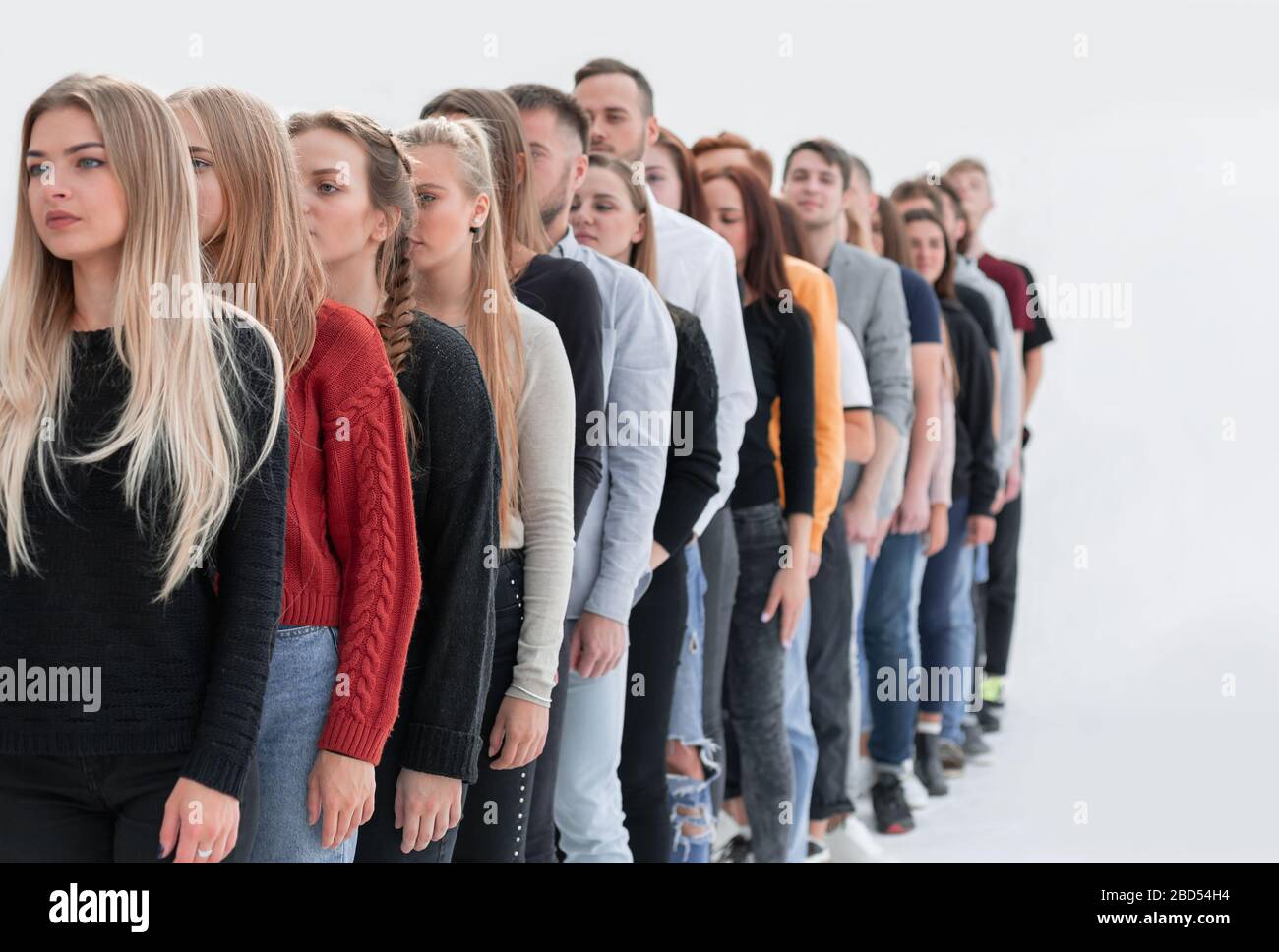group of diverse young people standing in line Stock Photo - Alamy