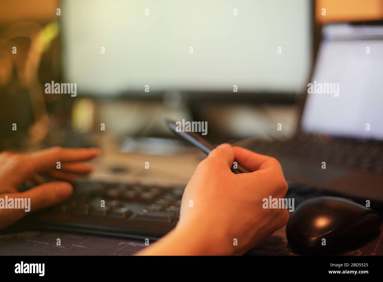 pointing laptop monitor with digital pen. working seriously with ...