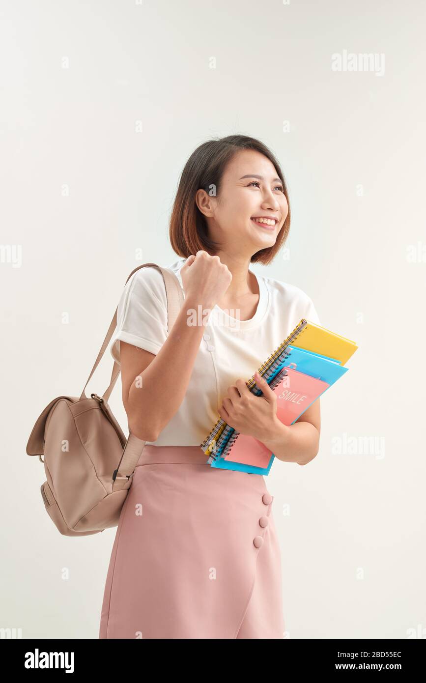Young happy attractive asian student smiling to camera expression ...