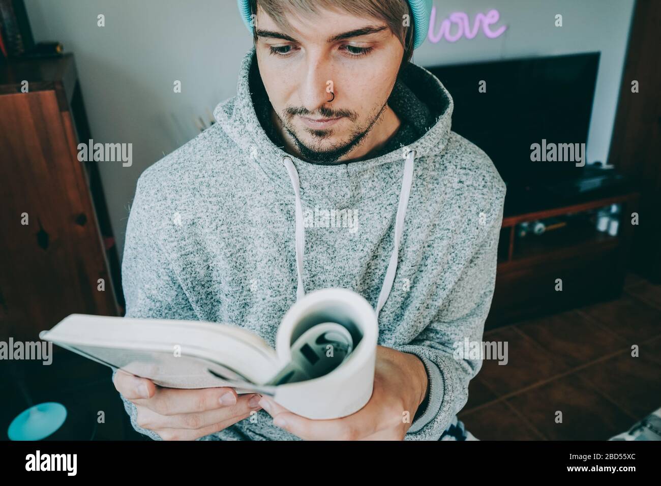Man piercing book hi-res stock photography and images - Alamy