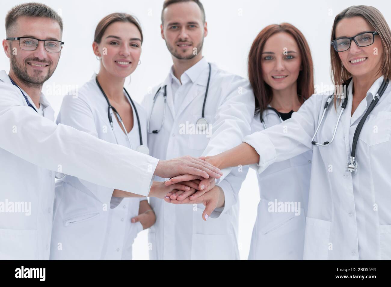 group of young doctors putting their palms together Stock Photo - Alamy
