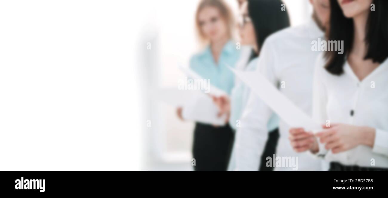 Manager and employees discussing business documents. Background for ...