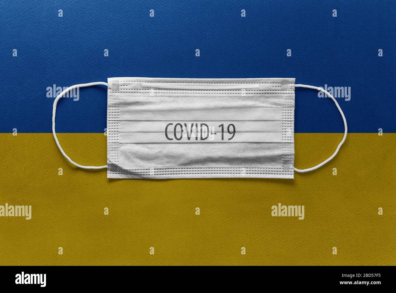 An individual face medical surgical mask on Ukraine National Flag ...