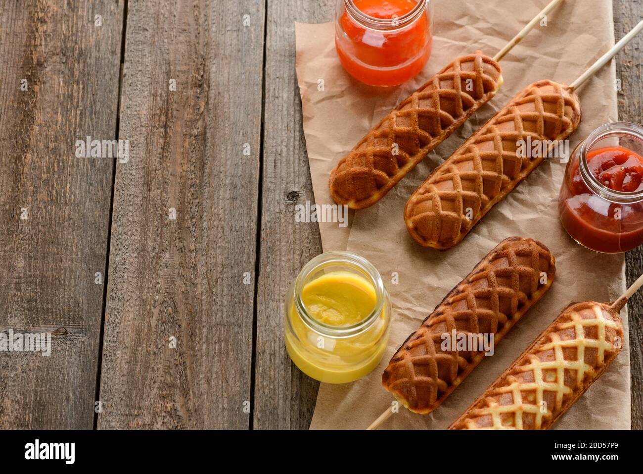 Corn dogs, mustard, ketchup and barbecue sauce Stock Photo - Alamy