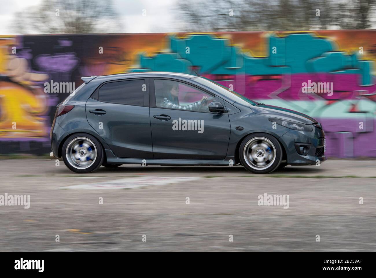 Modified Madza 2 compact car Stock Photo - Alamy