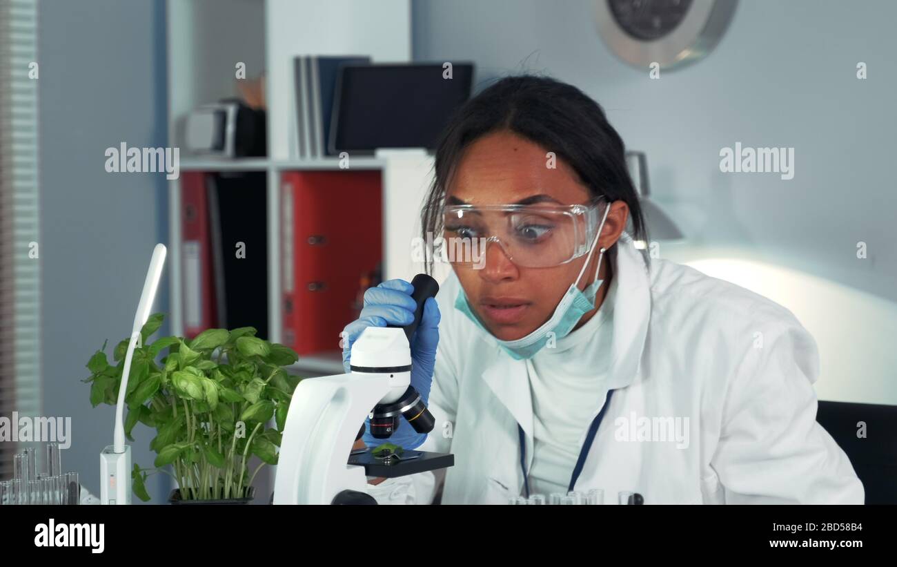 Coronavirus pandemic concept. Multiracial research scientist getting ...