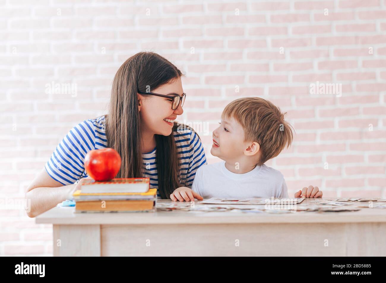 Teaching children with parents Stock Photo - Alamy Teaching children with parents Stock Photo - Alamy