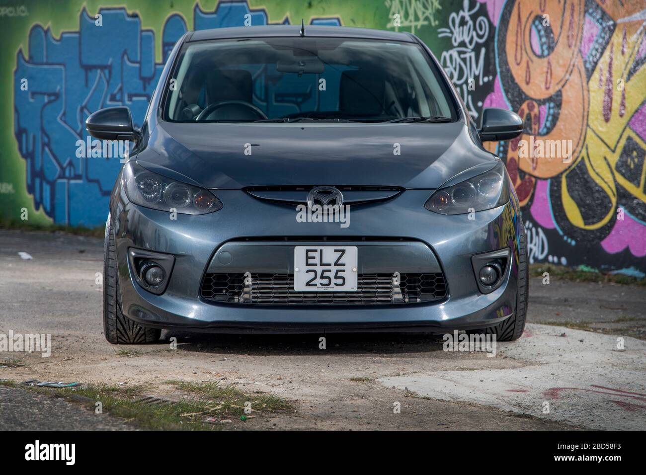 Modified Madza 2 compact car Stock Photo - Alamy