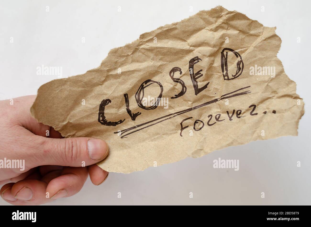 A piece of brown paper with handwritten inscription. The inscription is ...