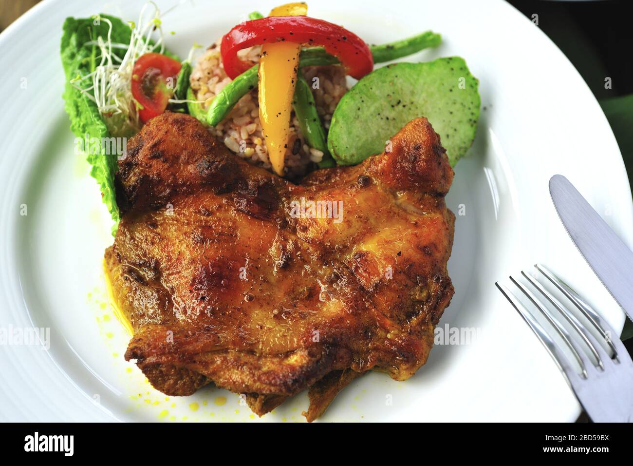 The food portrait of chicken on the white plate Stock Photo - Alamy
