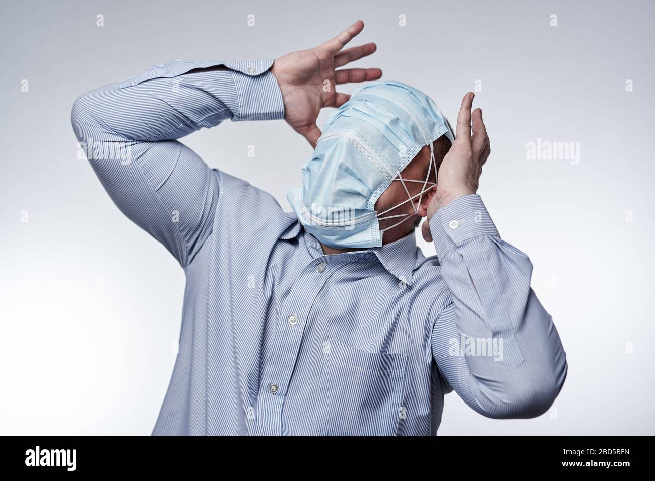 Man with exaggerated mask protection, whole face covered, making him ...