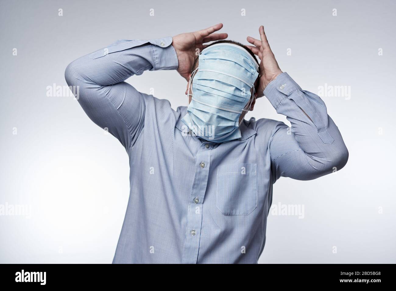 Man with exaggerated mask protection, whole face covered, making him ...