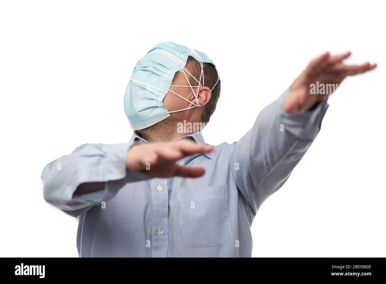 Man with exaggerated mask protection, whole face covered, making him ...