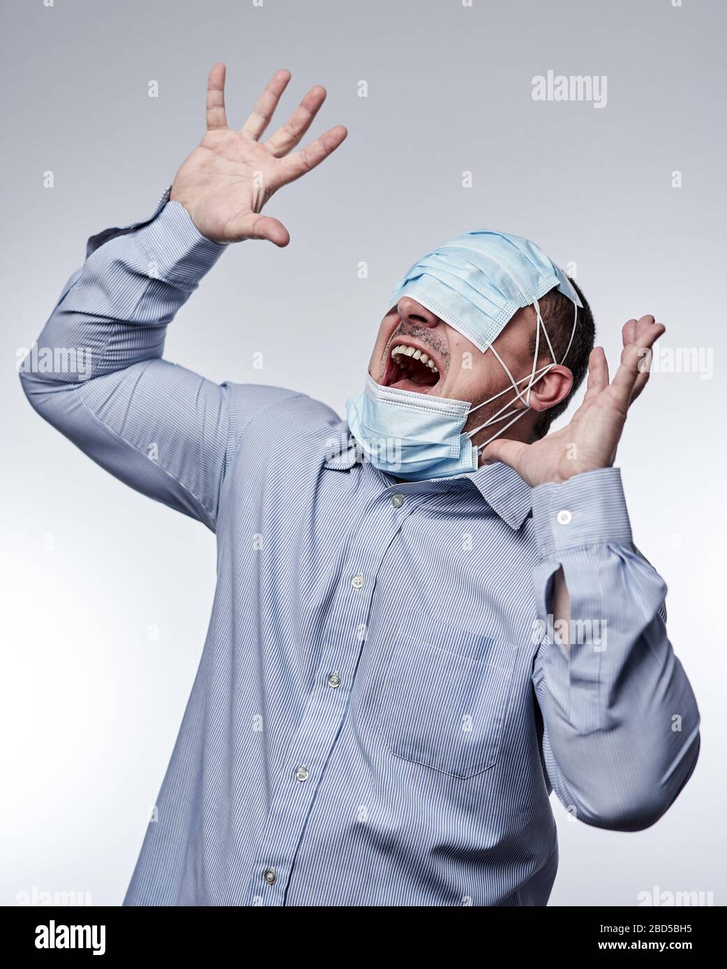 Man with exaggerated mask protection, whole face covered, making him ...